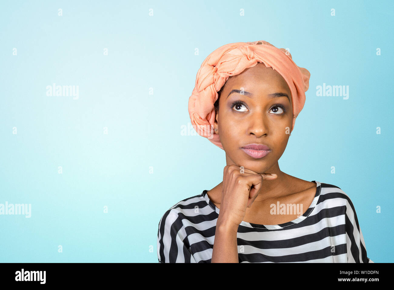 Young African American woman thinking Stock Photo - Alamy