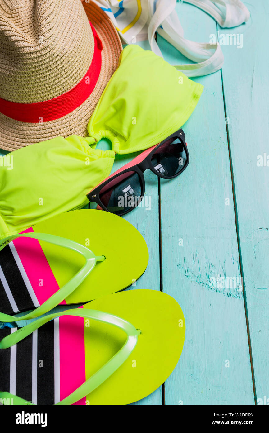 Beach accessories with yellow swimming suit,sunglasses and flip flops ...