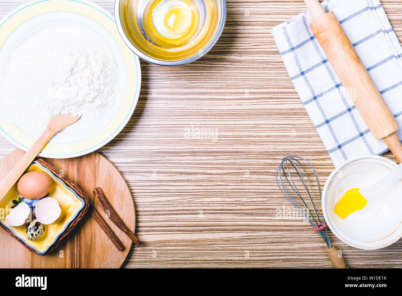 Wooden background with baking ingredients. Top view Stock Photo - Alamy