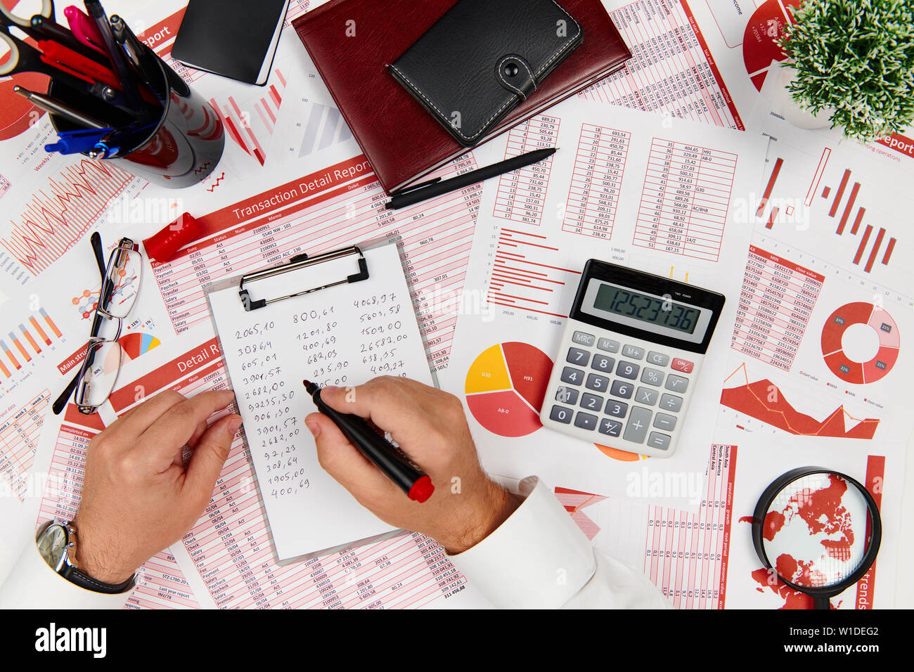 Business reports, data tables and charts - directly above view of ...