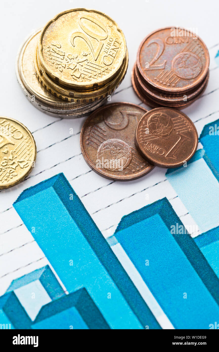 Graph Of Stock Market With Stacks Of Coins Stock Photo - Alamy