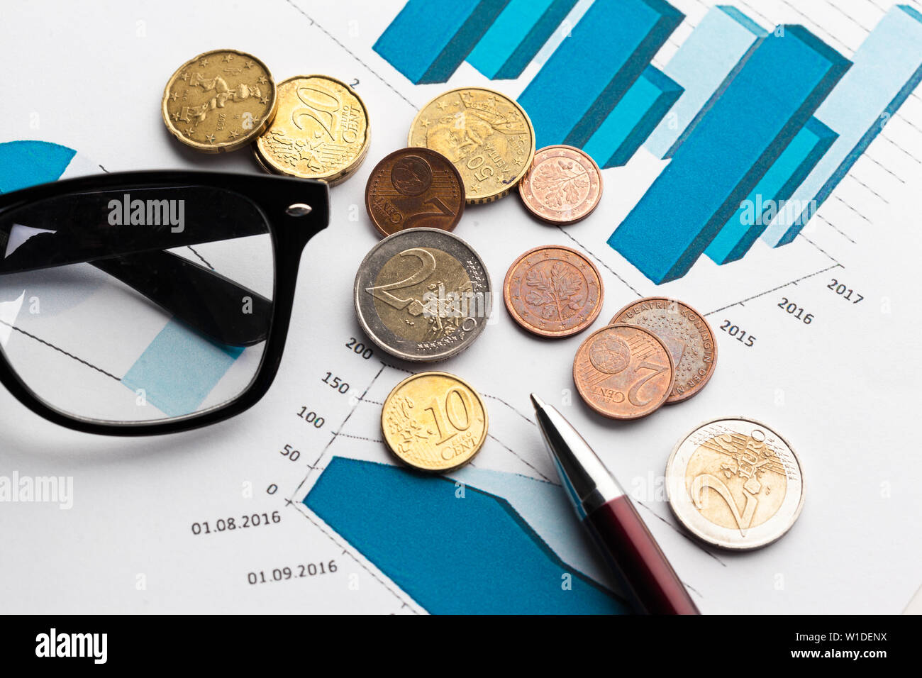 Graph Of Stock Market With Stacks Of Coins Stock Photo - Alamy