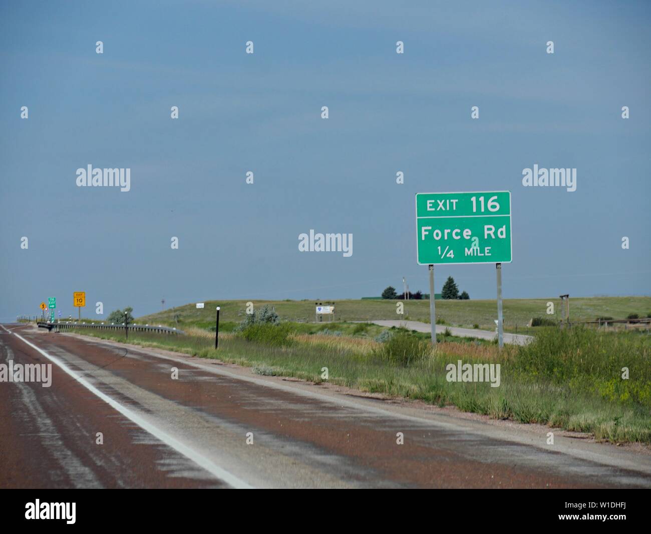 Sign along a red asphalt road outside of Gillette, Wyoming Stock Photo ...