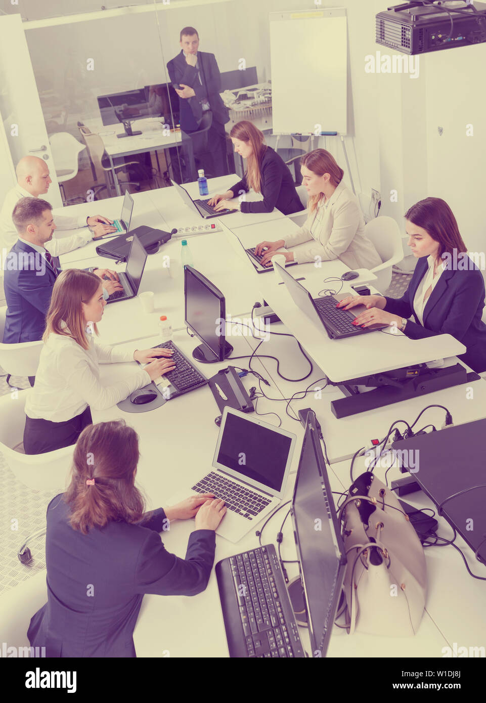 Business partners communicating in office hi-res stock photography and ...