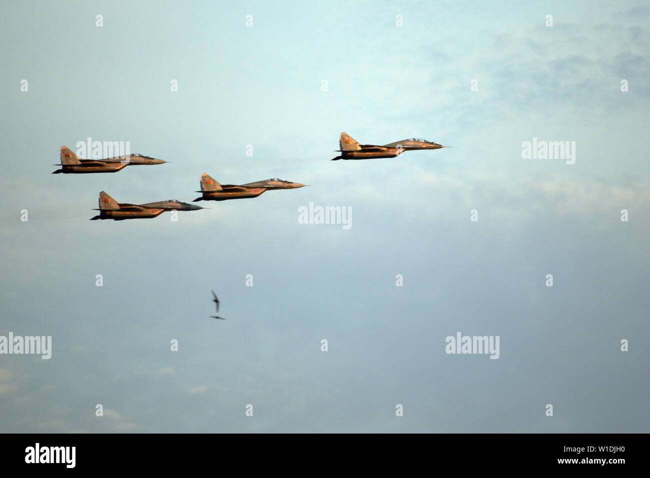 Minsk, Belarus - July 1, 2019 Flight of aircraft over the city, a group ...