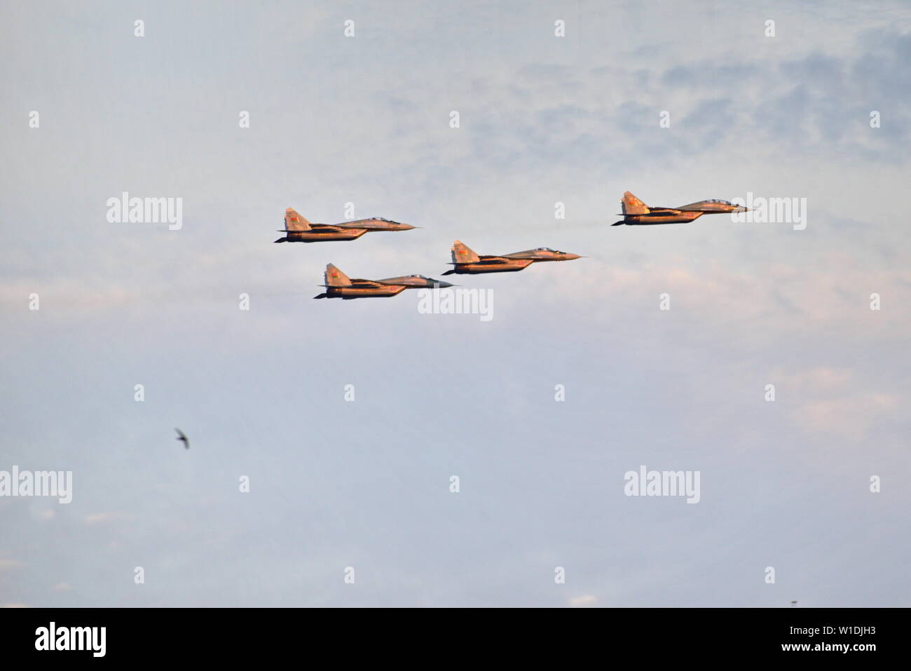 Minsk, Belarus - July 1, 2019 Flight of aircraft over the city, a group ...