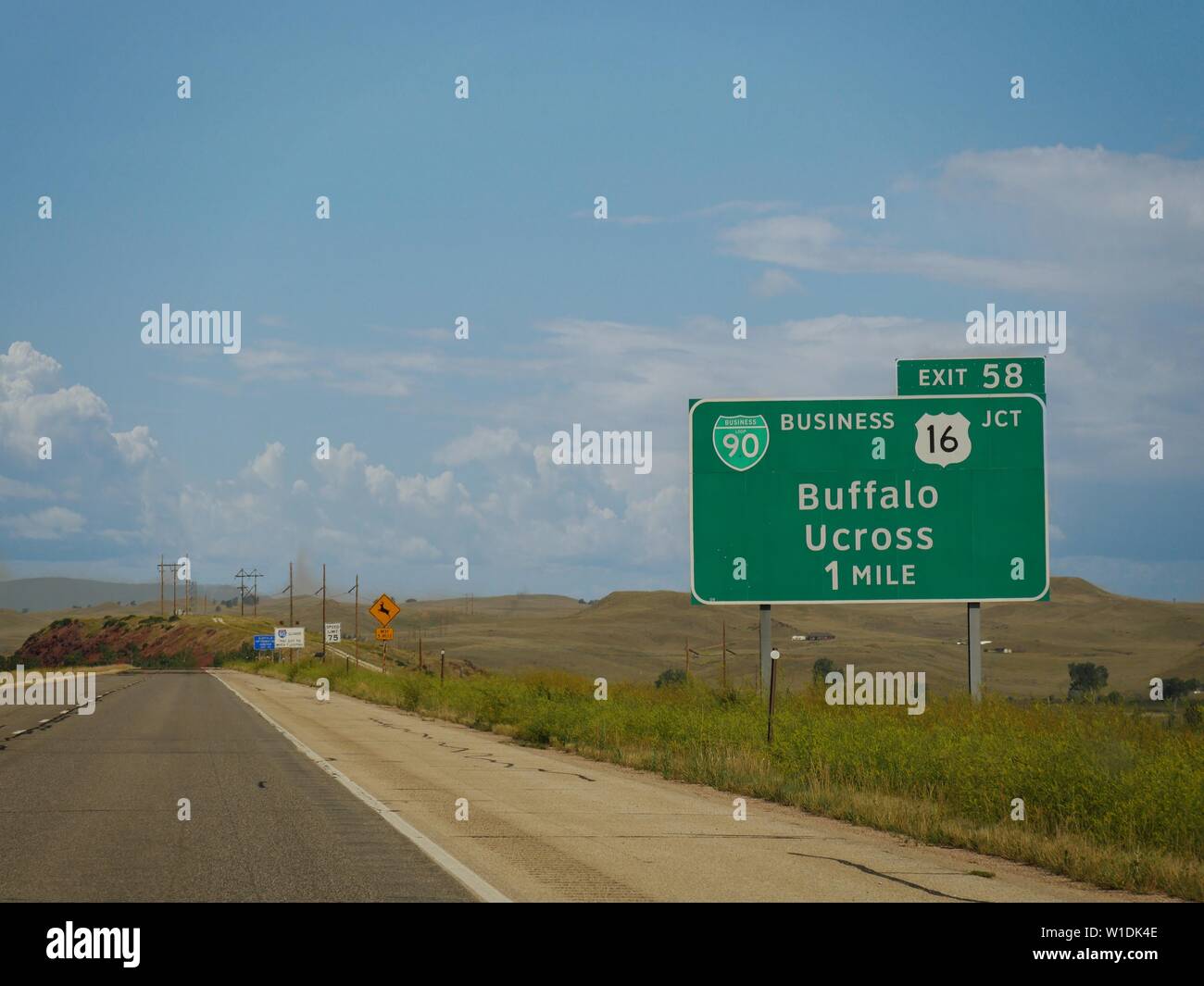 Directional and speed limit signs along the road approaching Buffalo ...