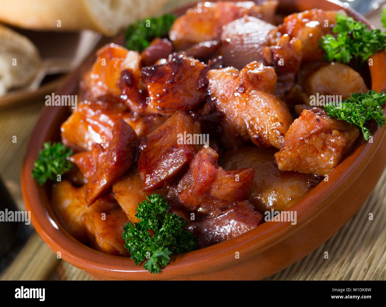 Morro de cerdo, appetizing braised pork snout garnished with fresh ...