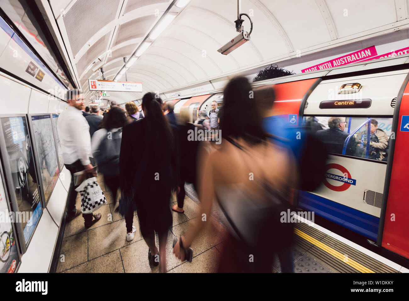 LONDON - JUNE 26, 2019: People and train on platform at tube train ...