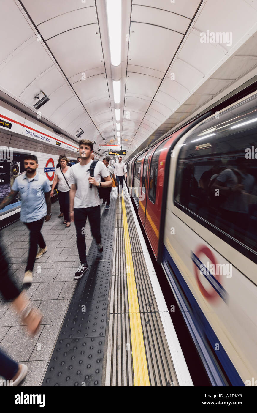 LONDON - JUNE 26, 2019: People and train on platform at Tottenham Court ...