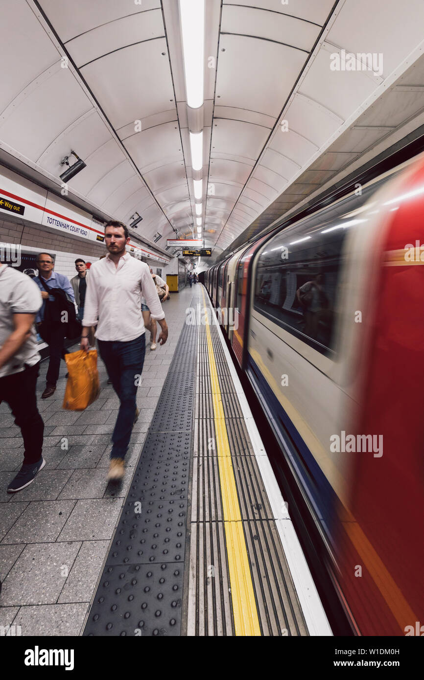 LONDON - JUNE 26, 2019: People and train on platform at Tottenham Court ...