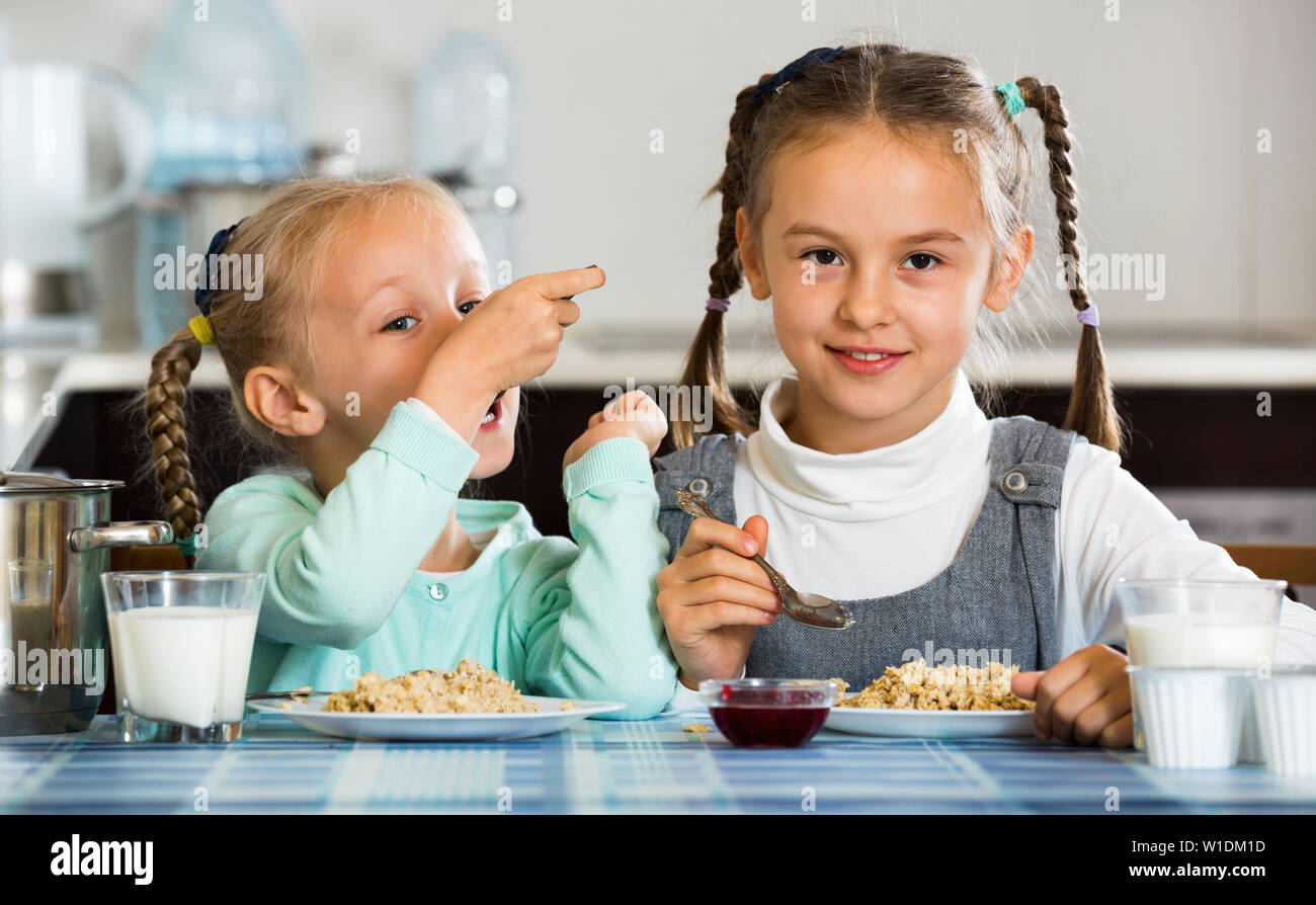 Kid eating oatmeal hi-res stock photography and images - Alamy