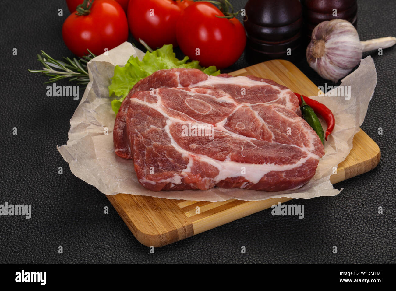 Raw pork neck steak ready for cooking Stock Photo - Alamy