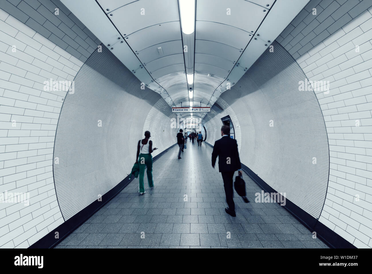 LONDON - JUNE 26, 2019: People walking in modern city tunnel on London ...