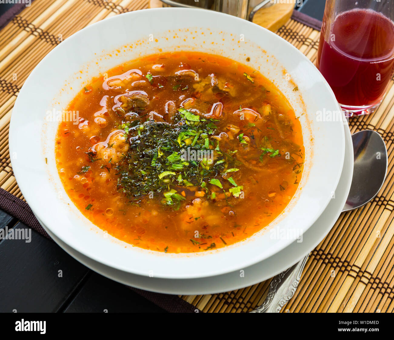 Rich mutton broth with rice, tomatoes and herbs – traditional Georgian ...