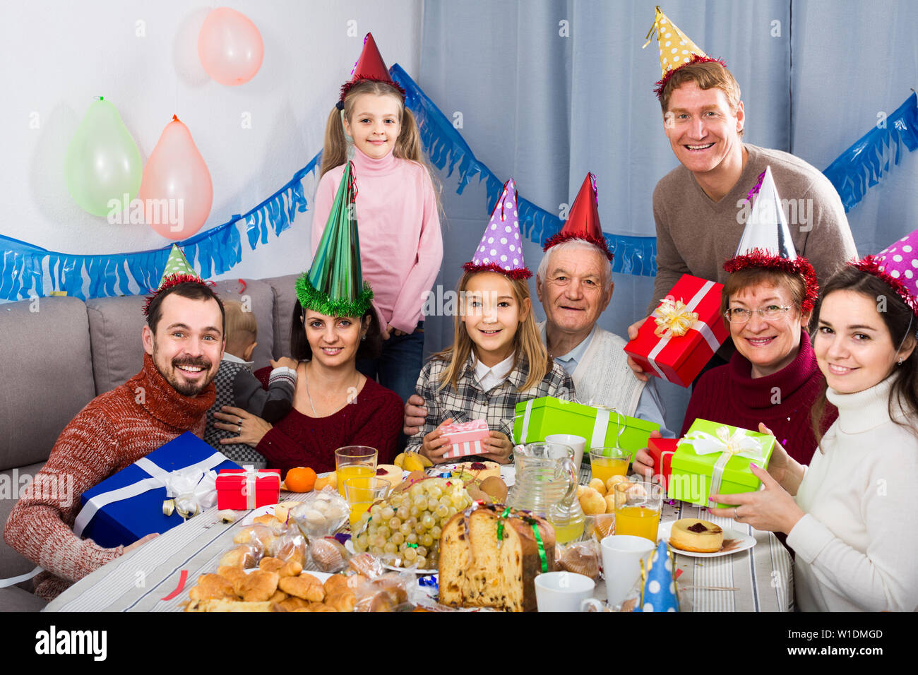 Large smiling family having fun during children’s birthday party Stock ...