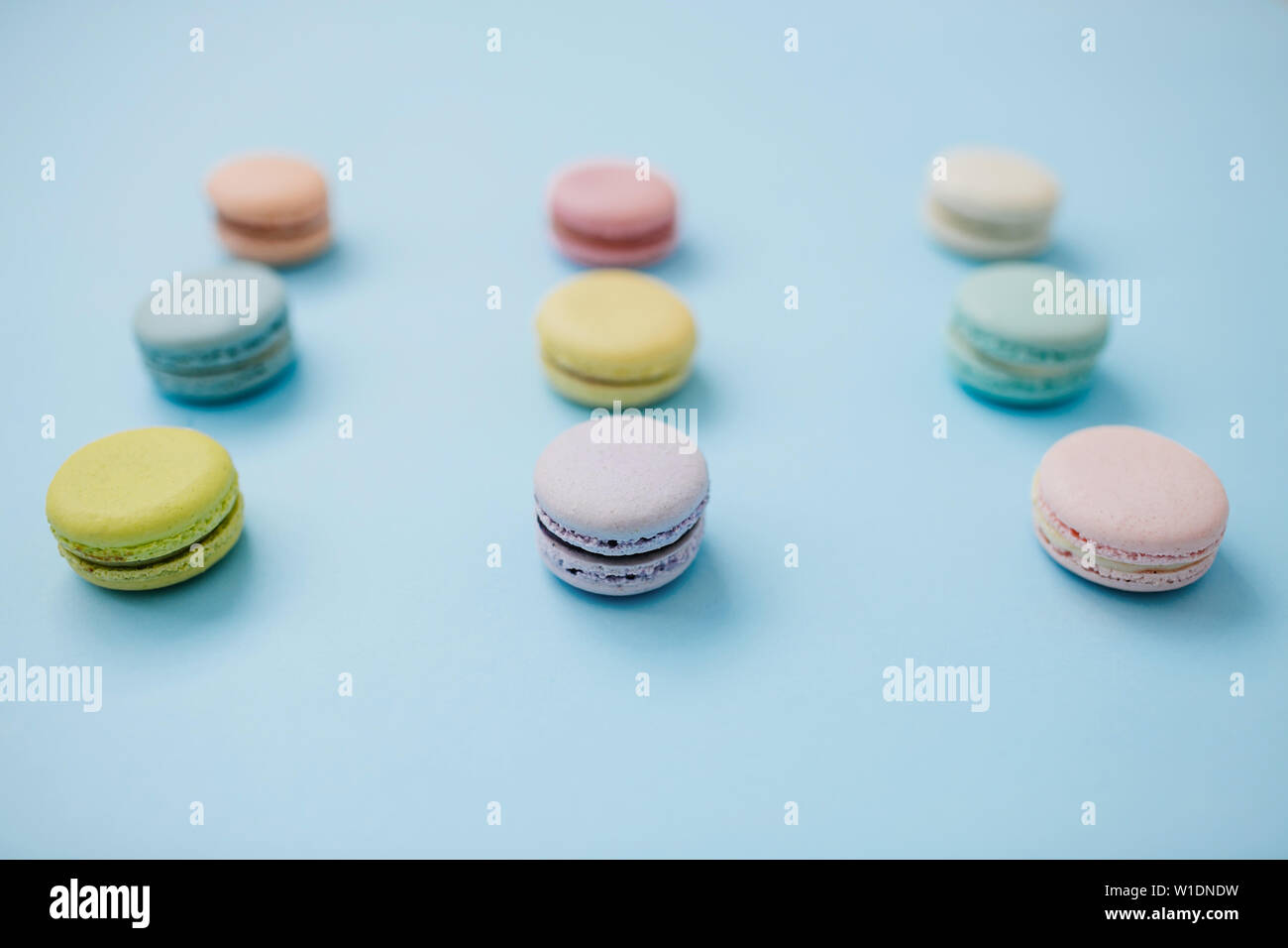 Closeup of delicious sweet French macaroon or macaron biscuits lying in ...