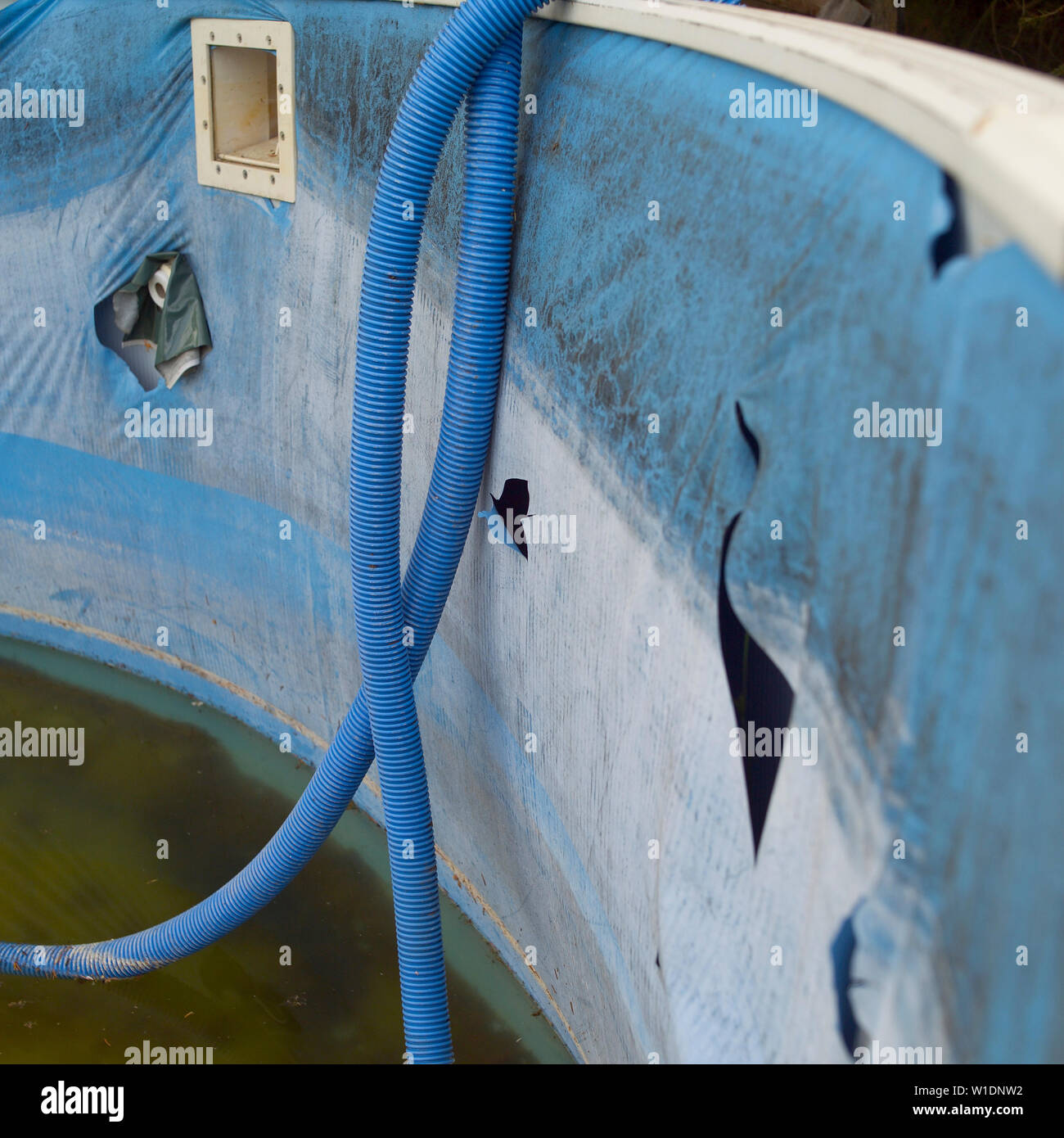 Abandoned outdoor swimming pool with completely damaged liner Stock ...