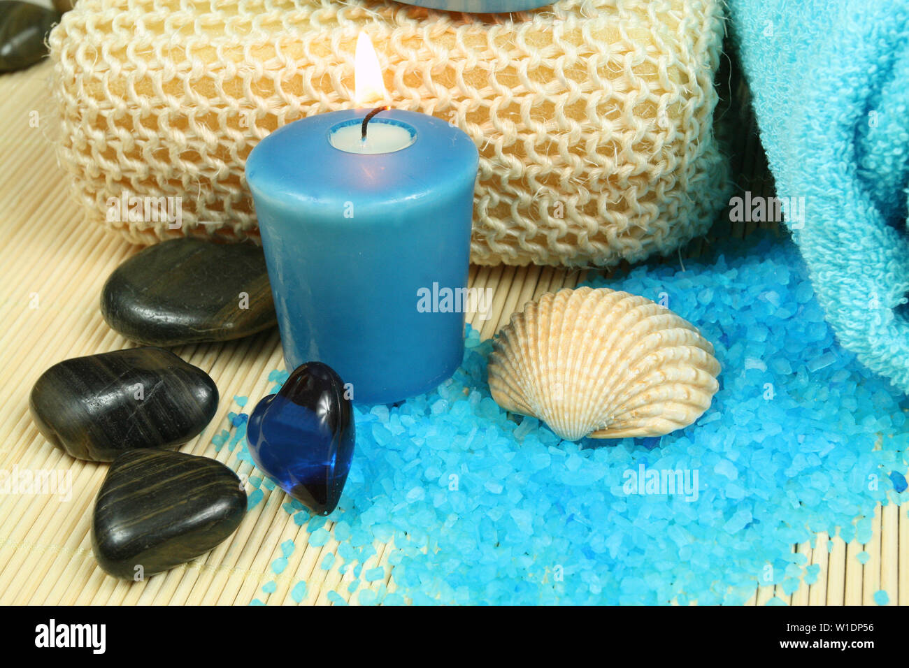 Spa soothe in blue color. Wellness therapy with pebbles and candle ...