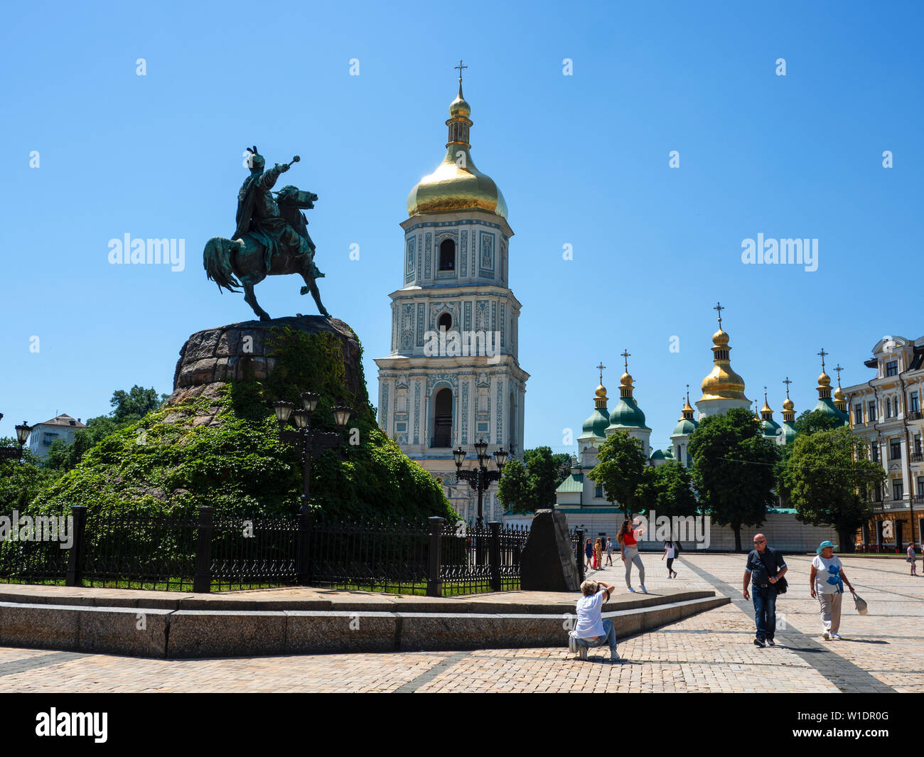 Tourists are photographed in front of the Monument to Bogdan ...