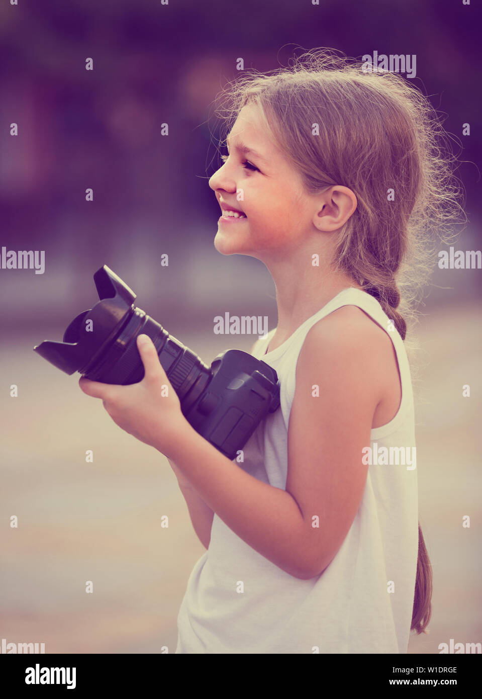 Portrait smiling photographer holding hi-res stock photography and ...