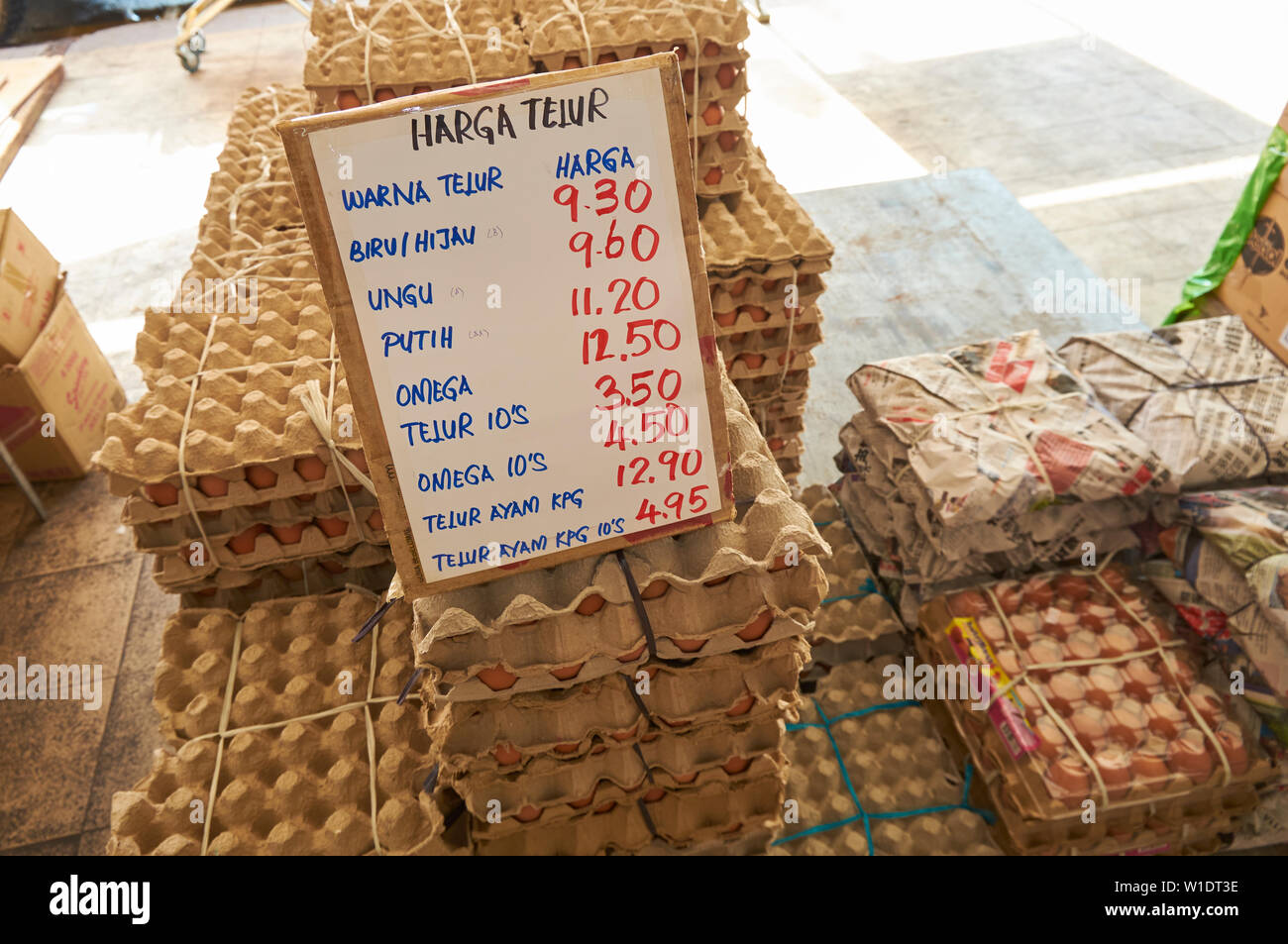 A variety of local brown eggs for sale with a price list at the main ...