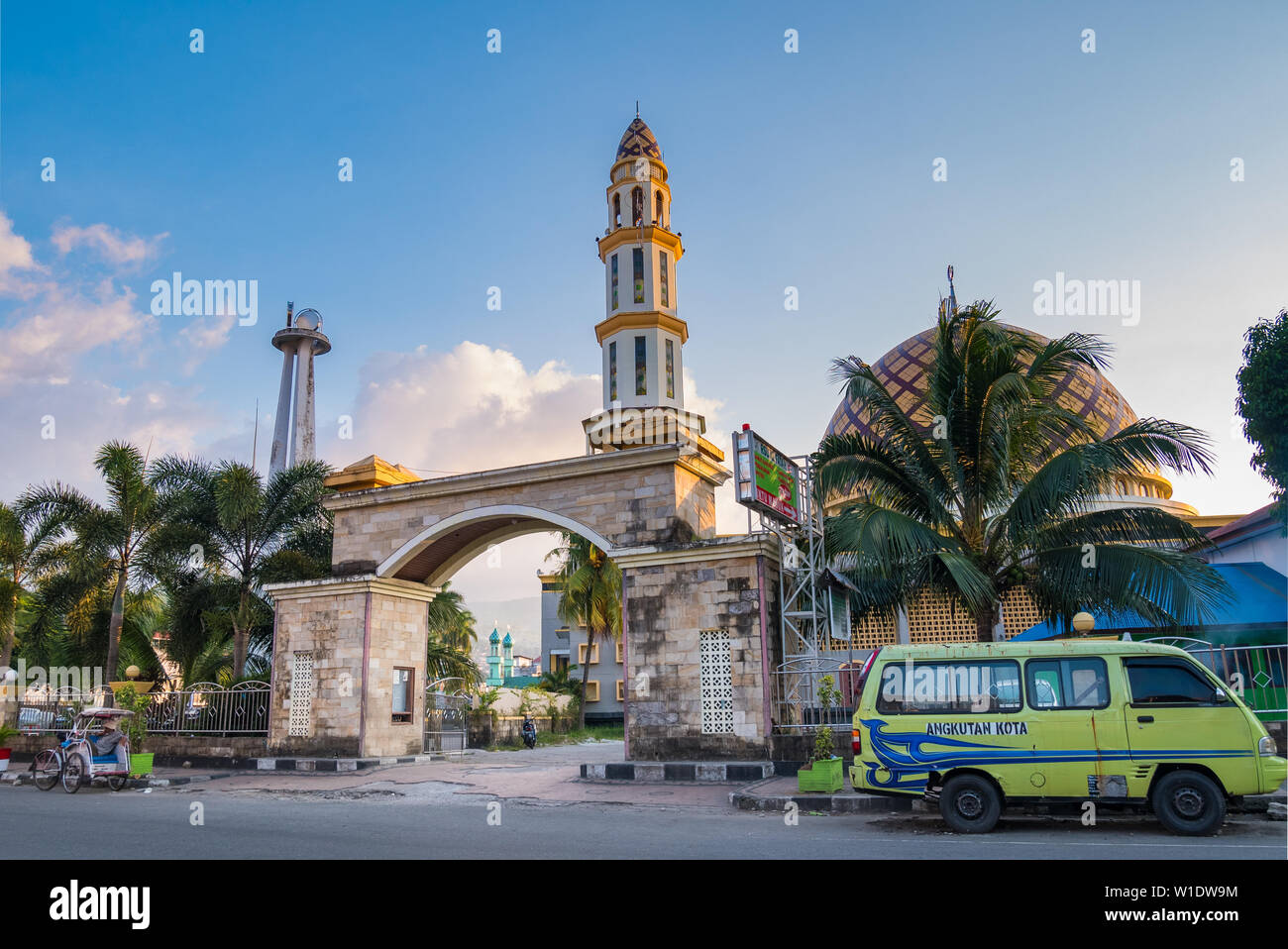 Ambon, Indonesia - october 7, 2018: street mosque and green mini van ...