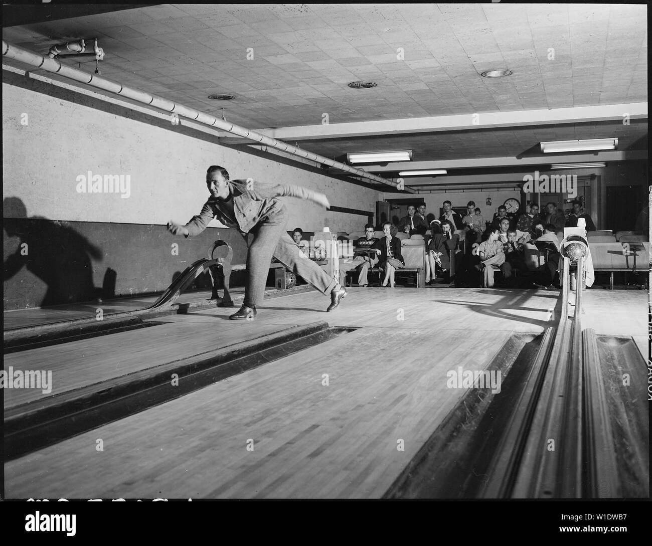 George Fain, son of Harry Fain, coal loader, bowling. There are 4 ...