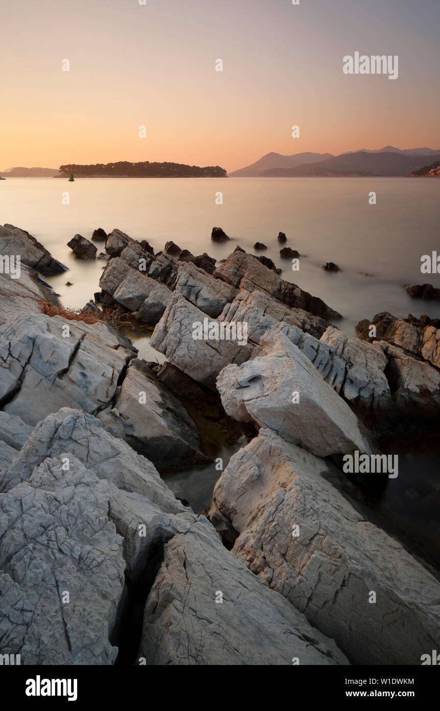 View showing rocks and coastal scenery during sunset near Dubrovnik ...