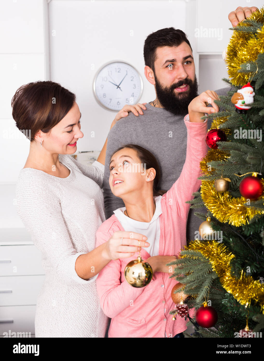 Family members preparing for Christmas together at home Stock Photo - Alamy