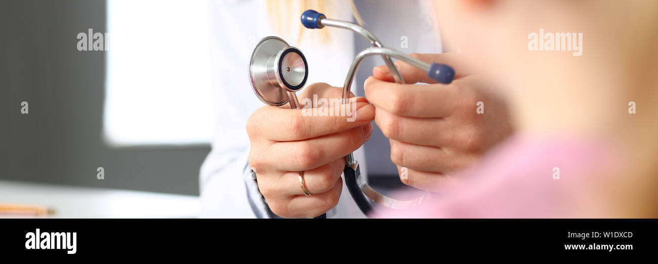 Female doctor arm hold stethoscope measuring patient heartbeat Stock ...