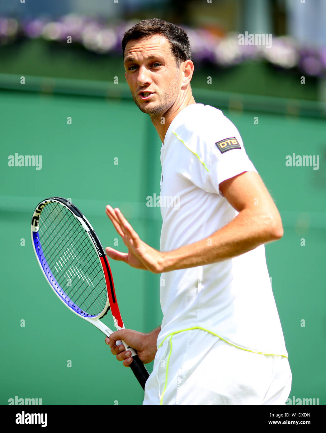 James Ward reacts on day two of the Wimbledon Championships at the All ...