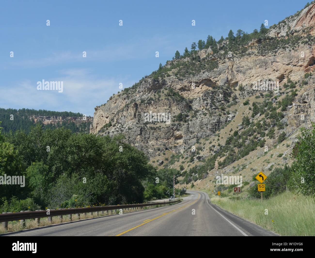 Incredible geologic formations and rocky wall cliffs along the road ...