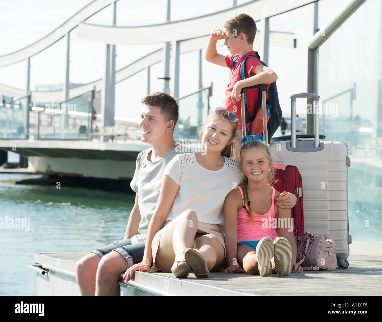 Young parents with two kids travelling together enjoying vacations in ...