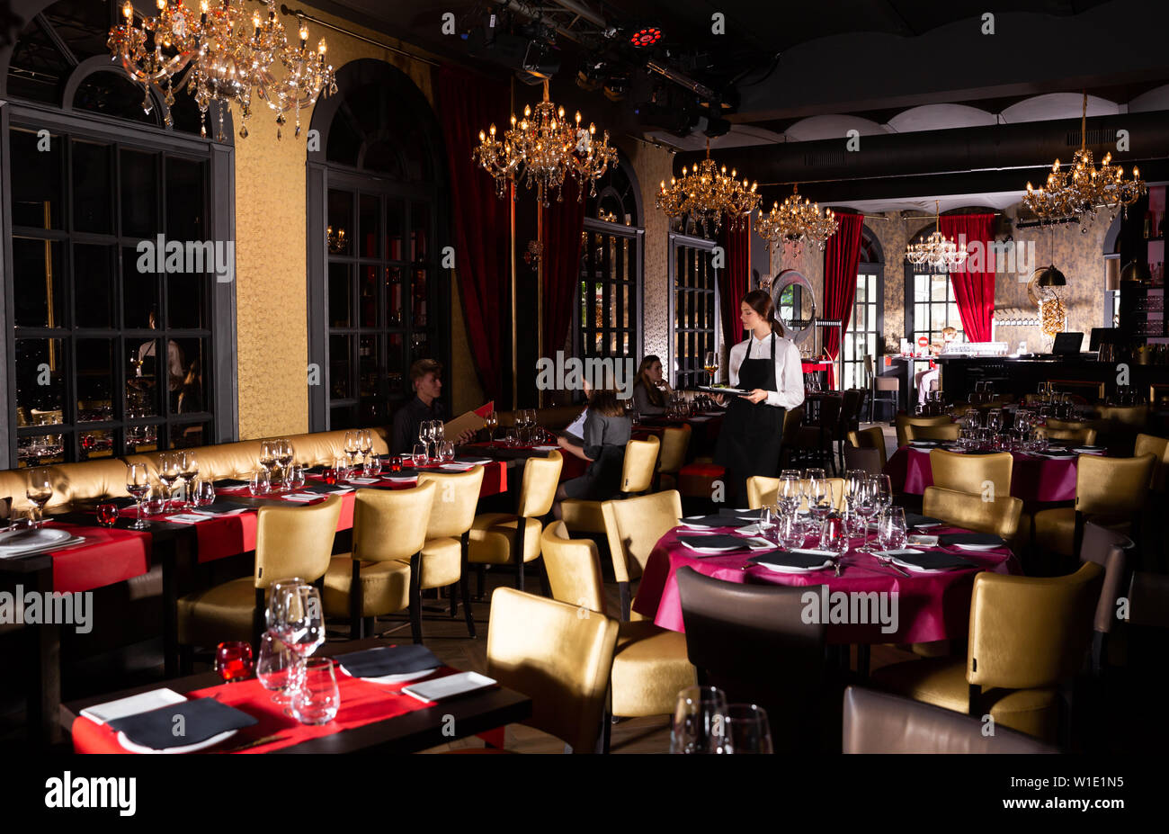 People having dinner at luxury restaurant in classic interior Stock ...