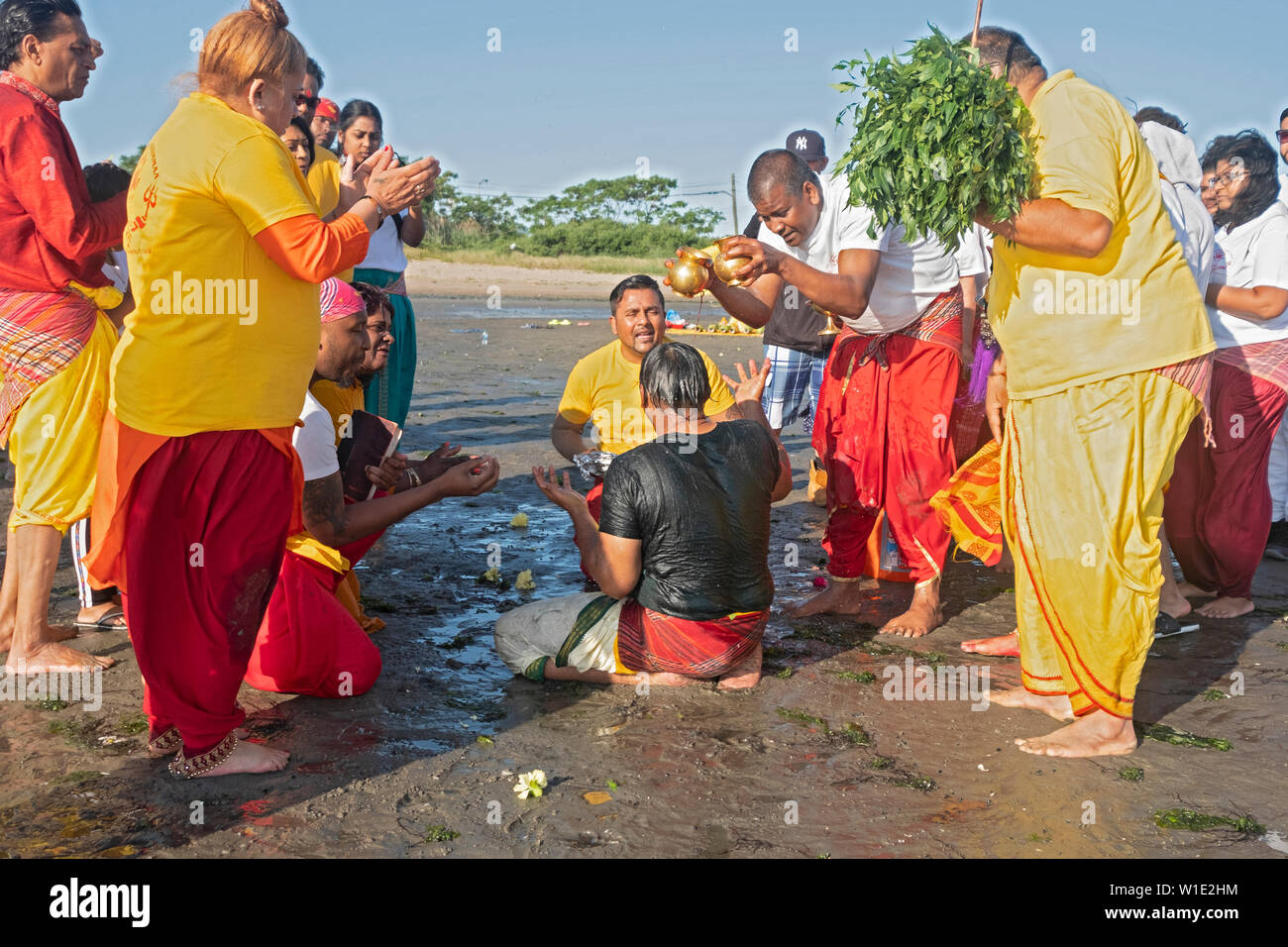 Prior to the the cleansing ritual of GANGA MAA POOSAI, a pujari gets ...