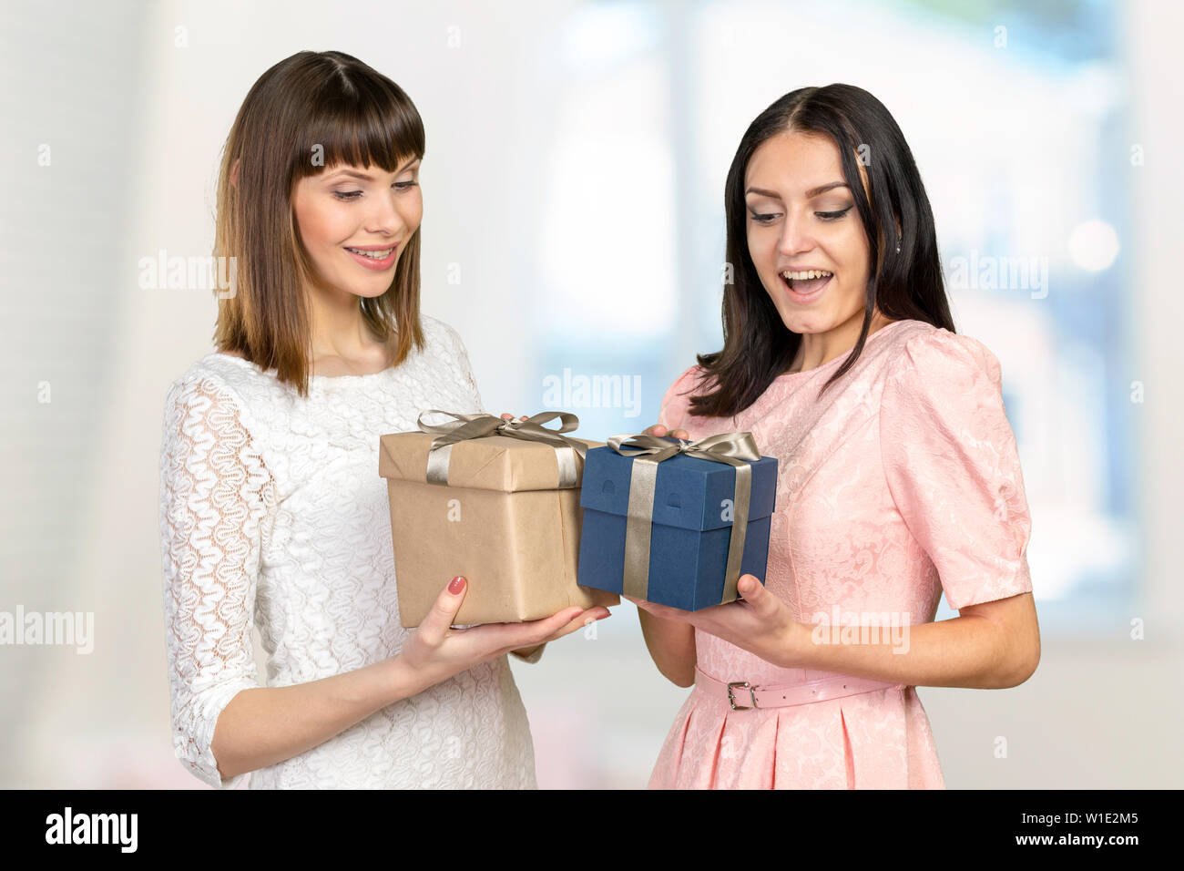 Two women exchanging present hi-res stock photography and images - Alamy