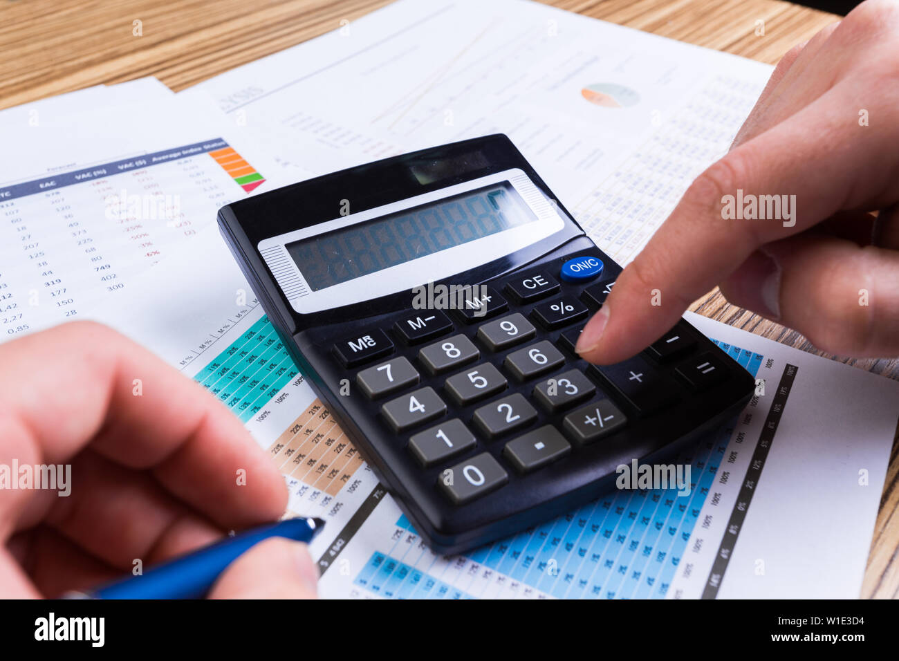 Graphs and Calculator Stock Photo - Alamy