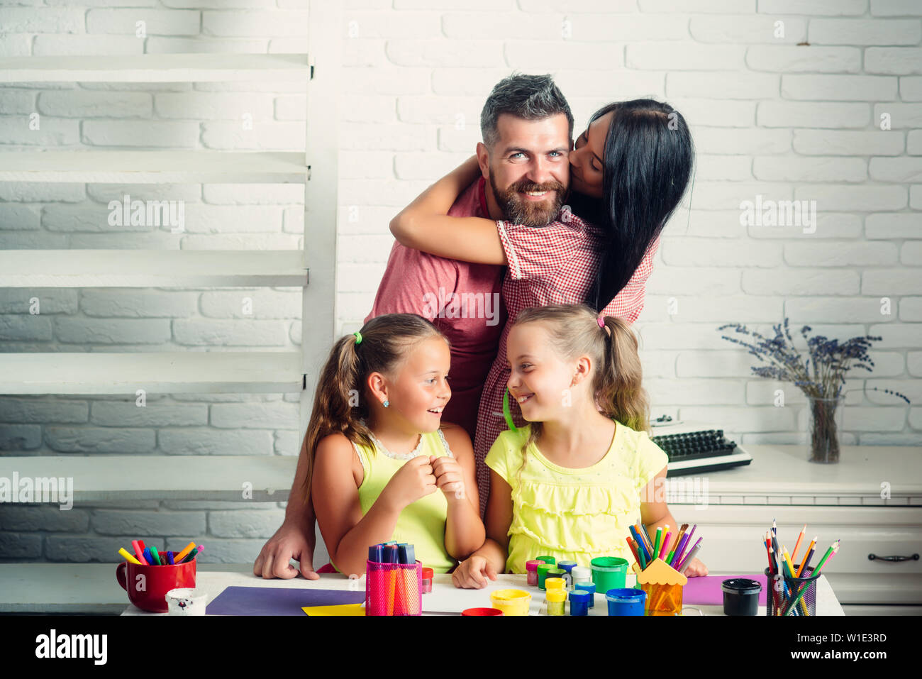 Family love and care concept. Girls smiling with colorful paints ...