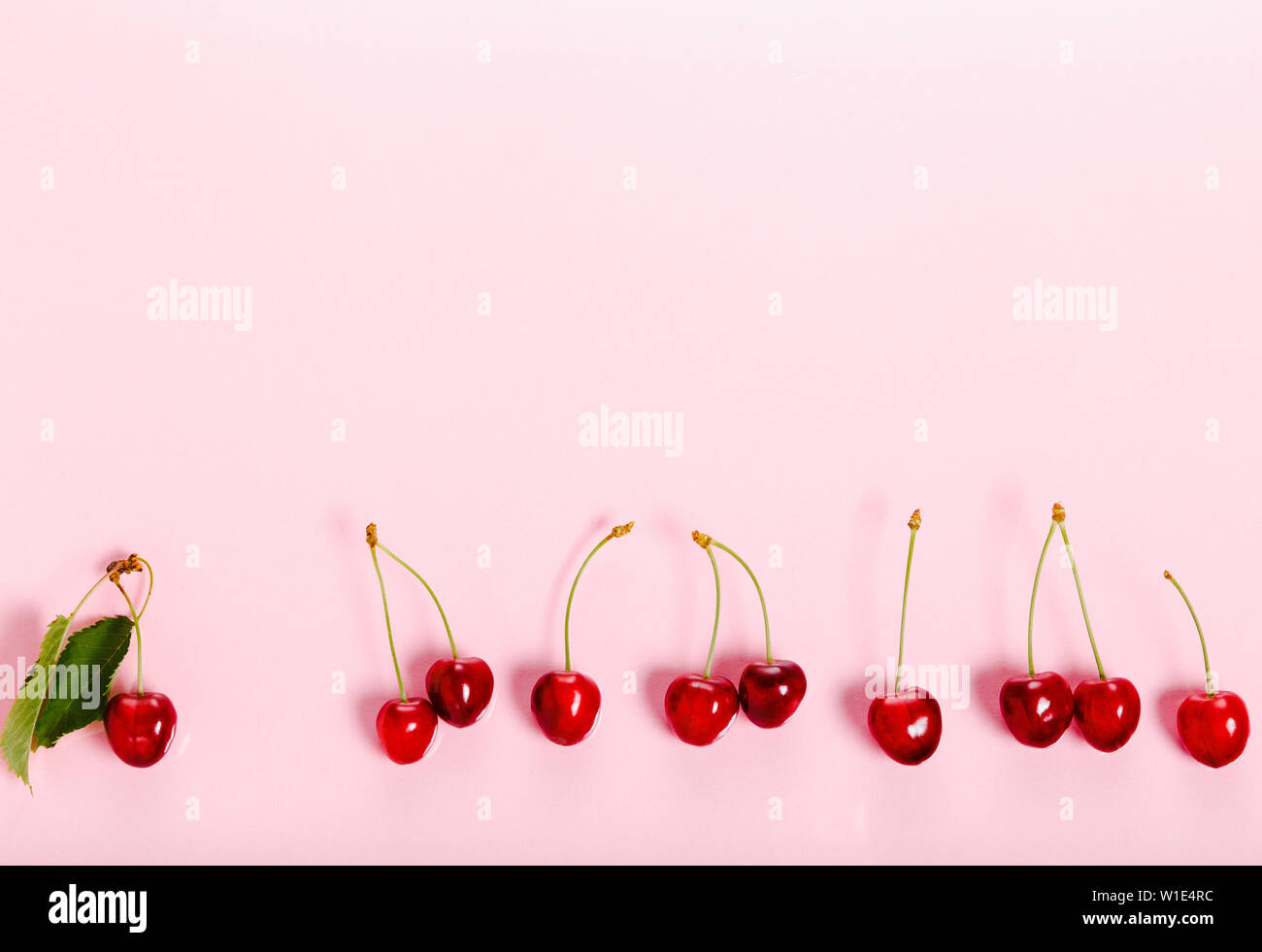 Tropical summer abstract background. Cherry cherries with cuttings and ...