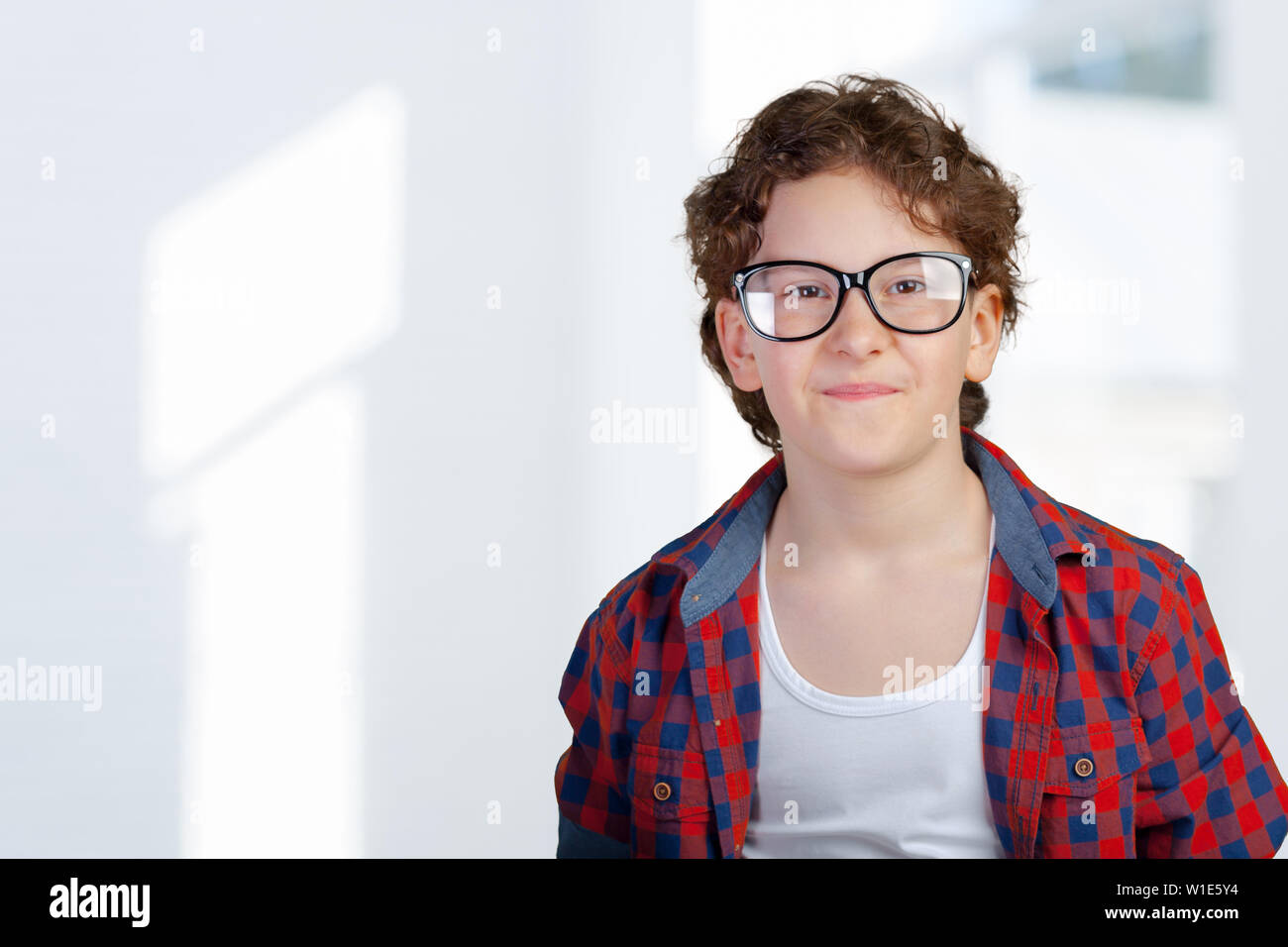Portrait of young boy wearing glasses Stock Photo - Alamy