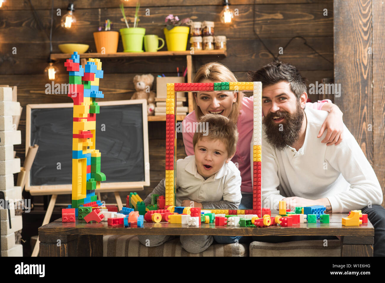 Creativity concept. Family build structure with toy bricks, creativity ...
