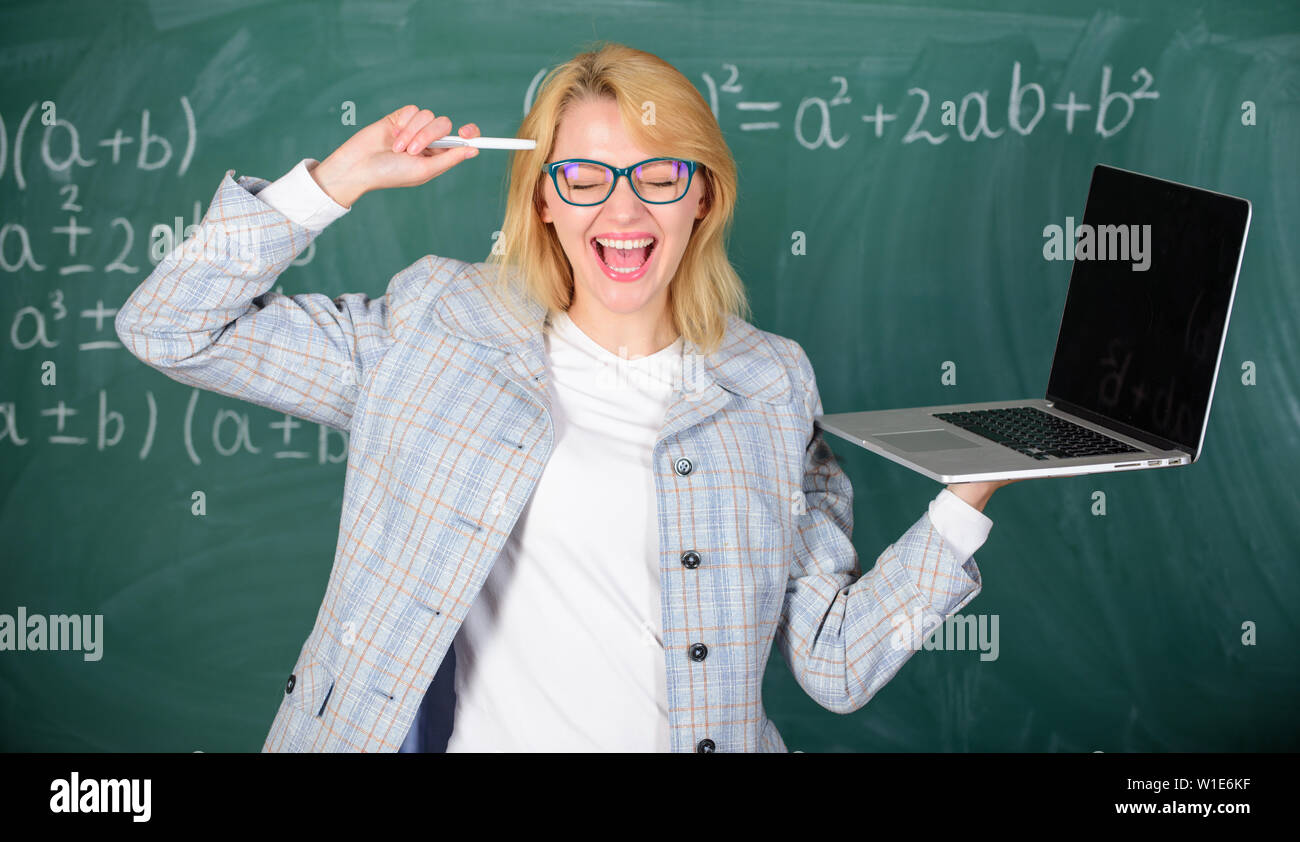 Educator smart clever lady with modern laptop surfing internet ...