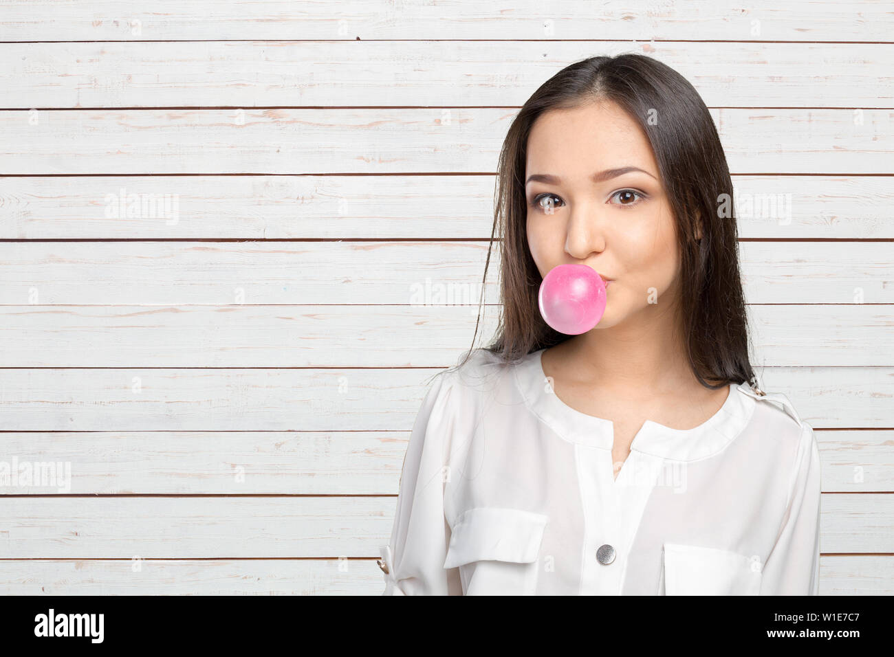 Woman eat bubble gum hi-res stock photography and images - Alamy