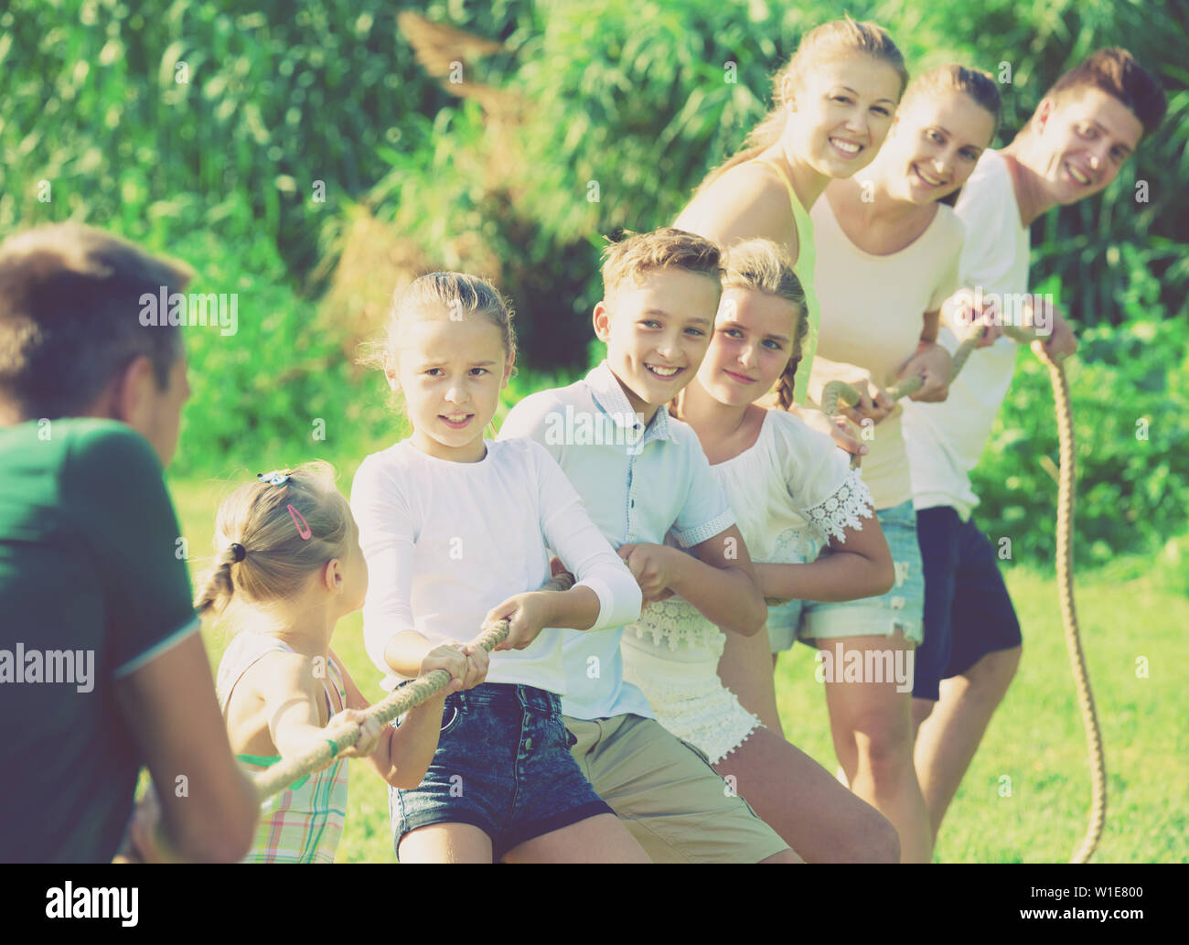 Kids adults playing grass hi-res stock photography and images - Alamy