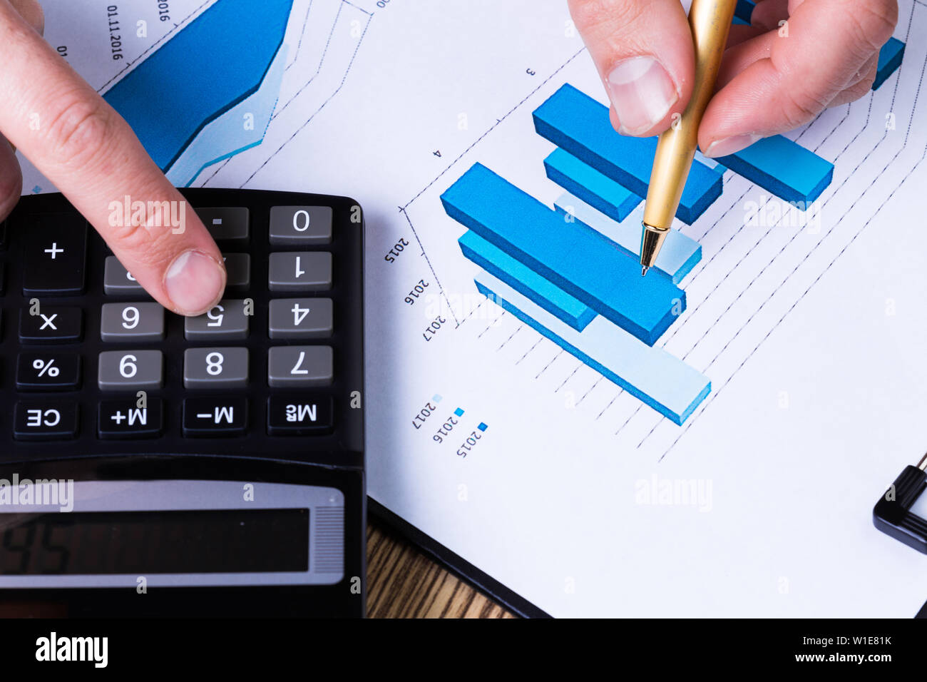 Graphs and Calculator Stock Photo - Alamy
