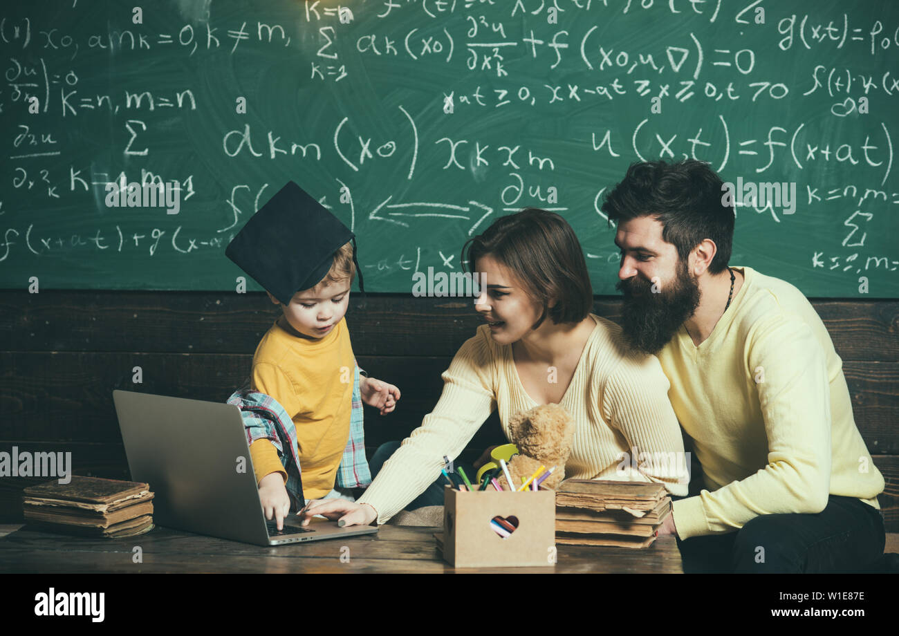 Modern education concept. Smart child in graduate cap likes to study ...