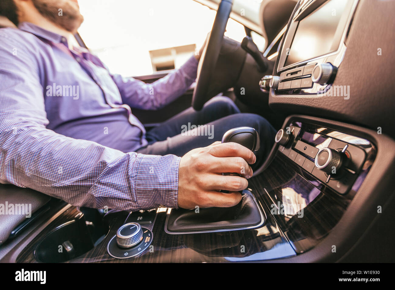 Close-up of a male hand in a modern car Stock Photo - Alamy