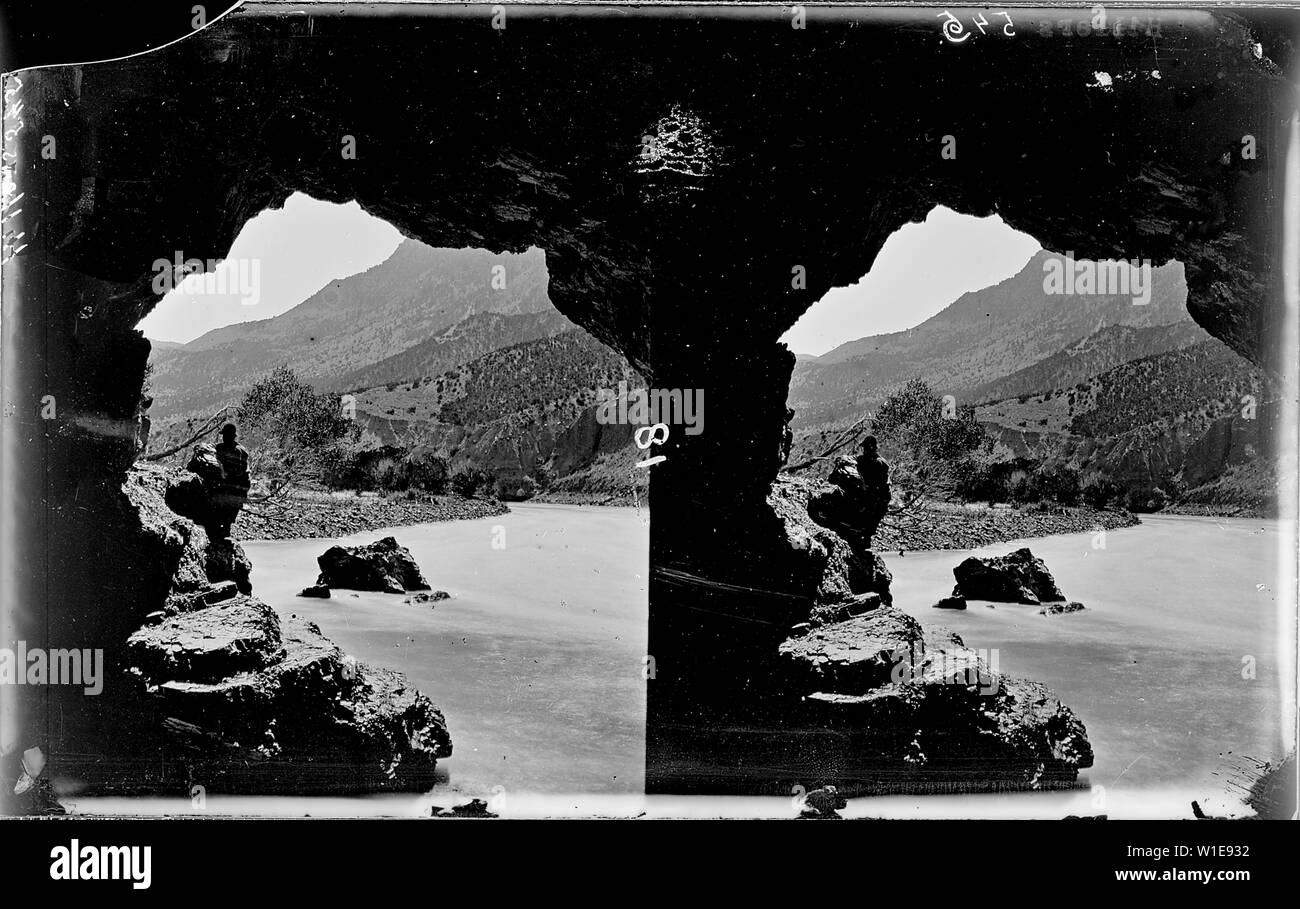 Green River. Split Mountain Canyon. Small cave, looking out. A man is ...