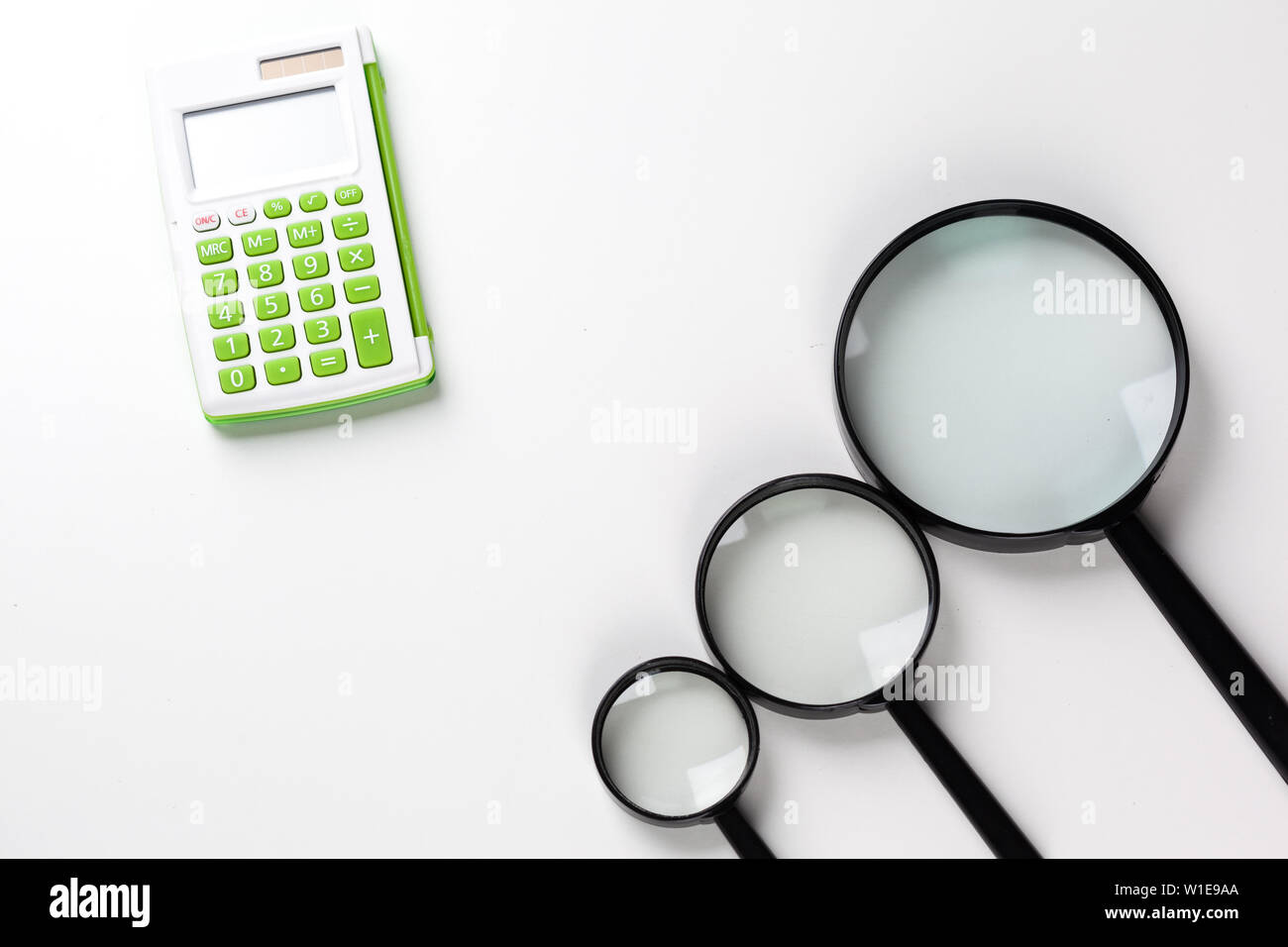 Three magnifiers over white Stock Photo - Alamy